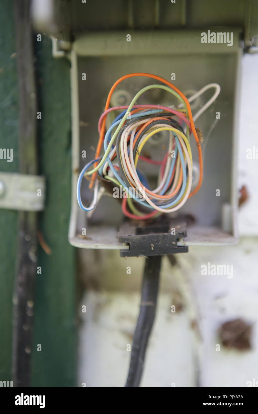 electric wires outside building facade wall Stock Photo - Alamy