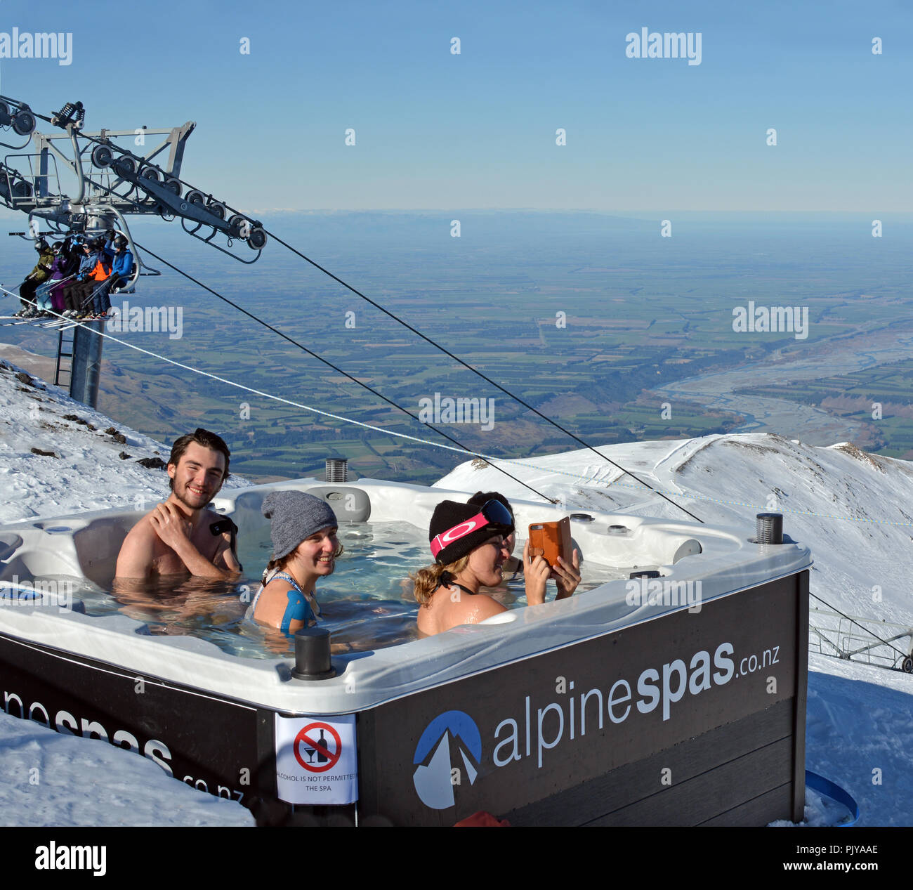 Young people in a Spa Bath at the Top of Mount Hutt Ski Field ...