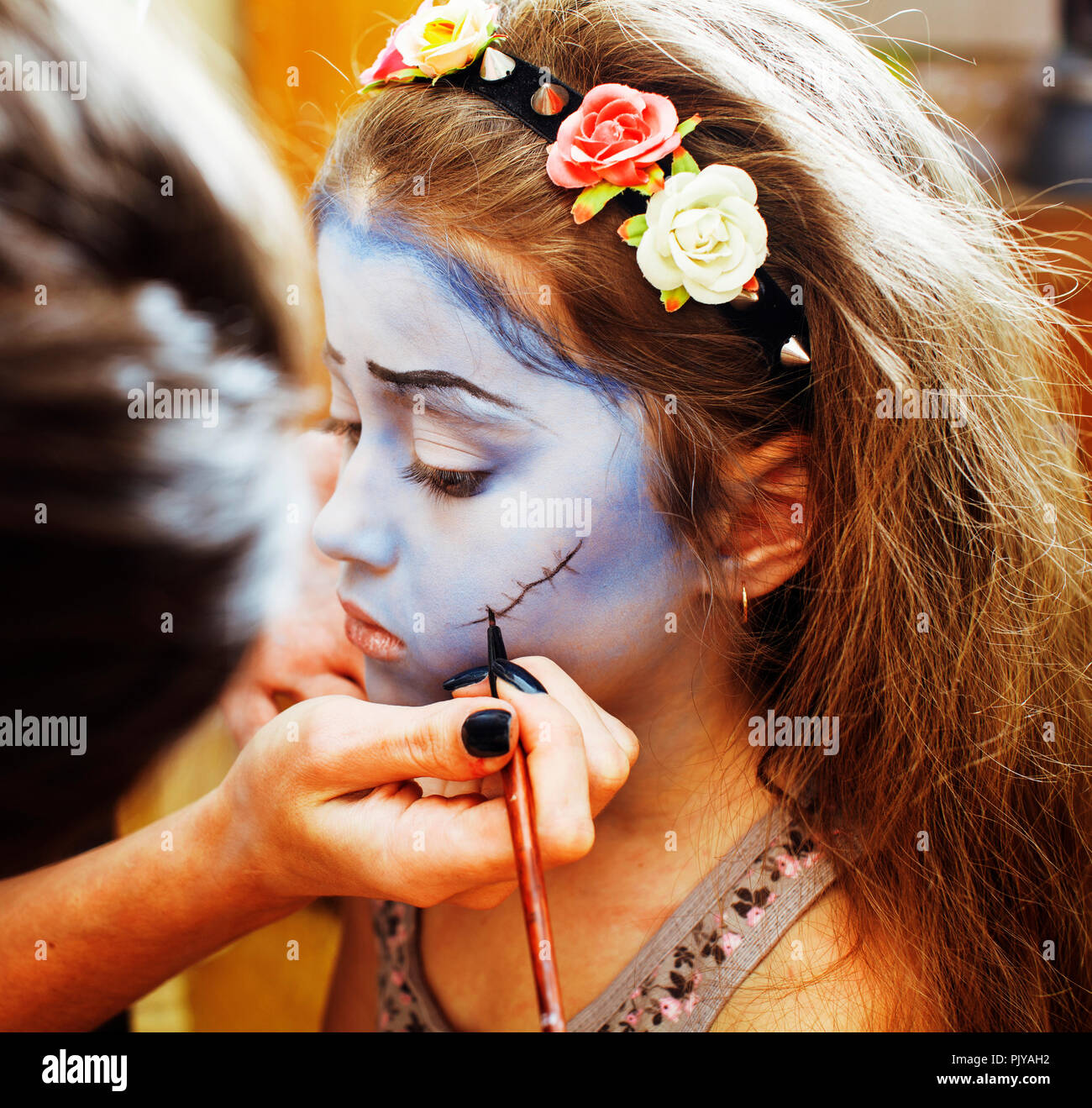 little cute child making facepaint on birthday party, zombie Apo Stock ...