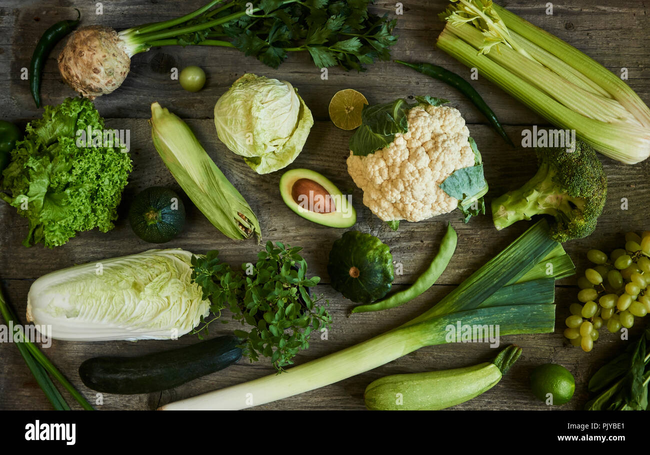 Flat lay series of assorted green toned vegetables, fresh organic raw ...