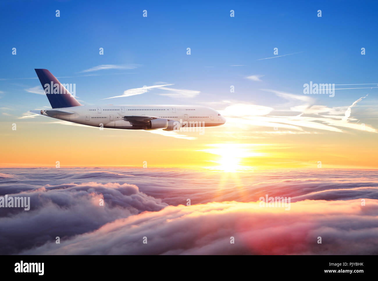 Huge two-storey passengers commercial airplane flying above clouds in ...