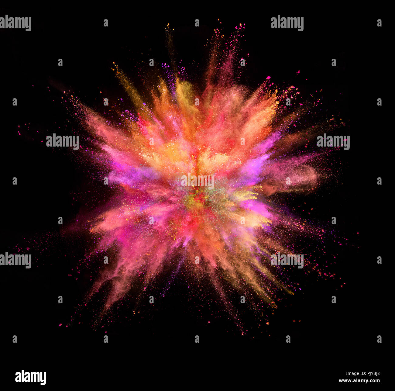 Explosion of coloured powder isolated on black background. Abstract ...