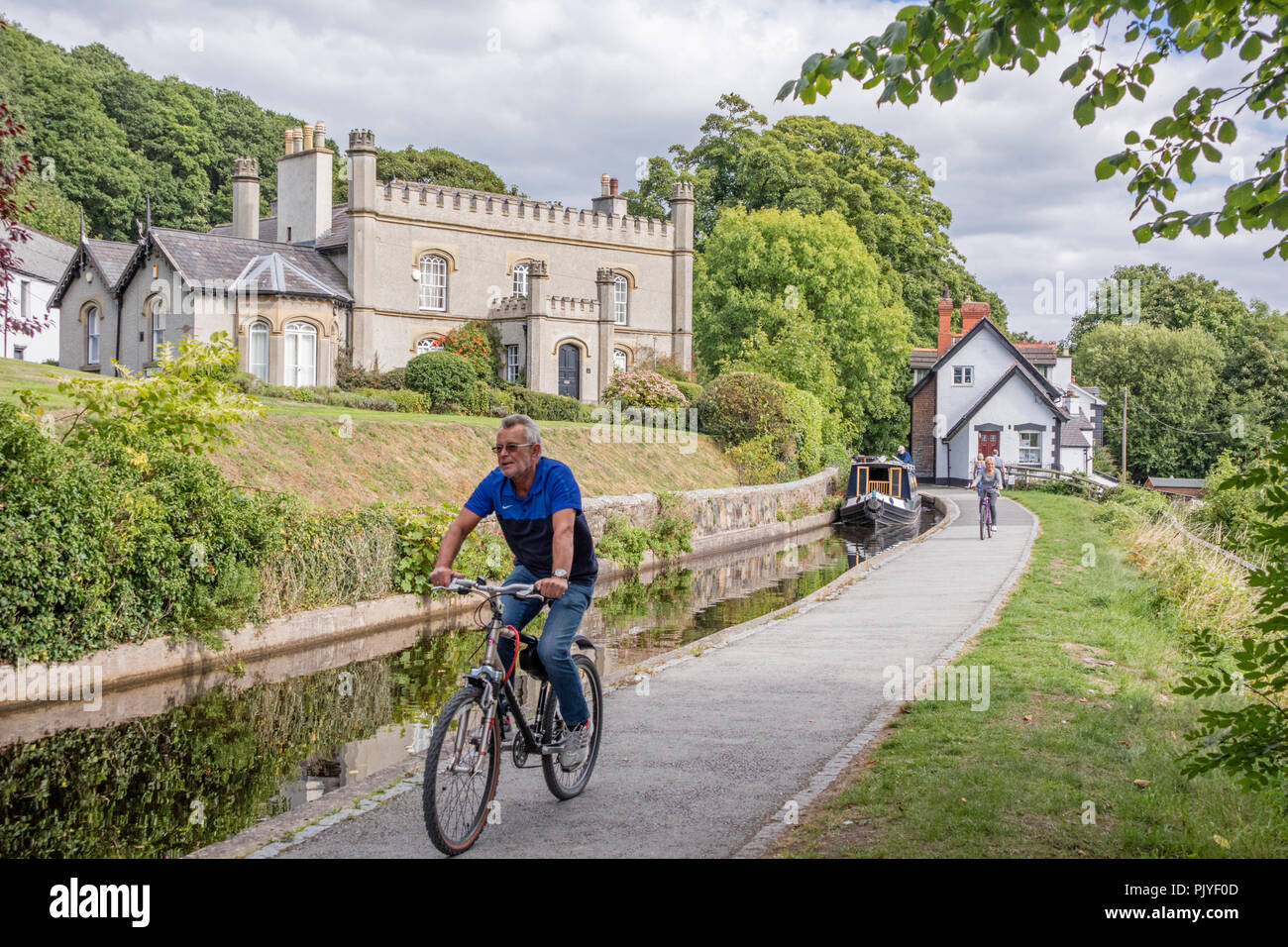 Boating and cycling on the Llangollen Canal near Llangollen, Wales, UK ...