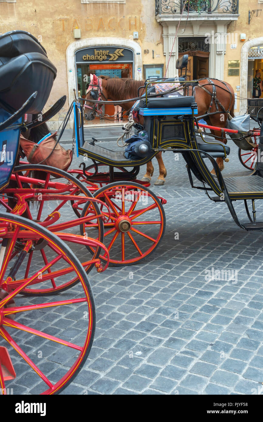 Horse-drawn carriages close to the Spanish Steps in Rome, Italy, Europe ...