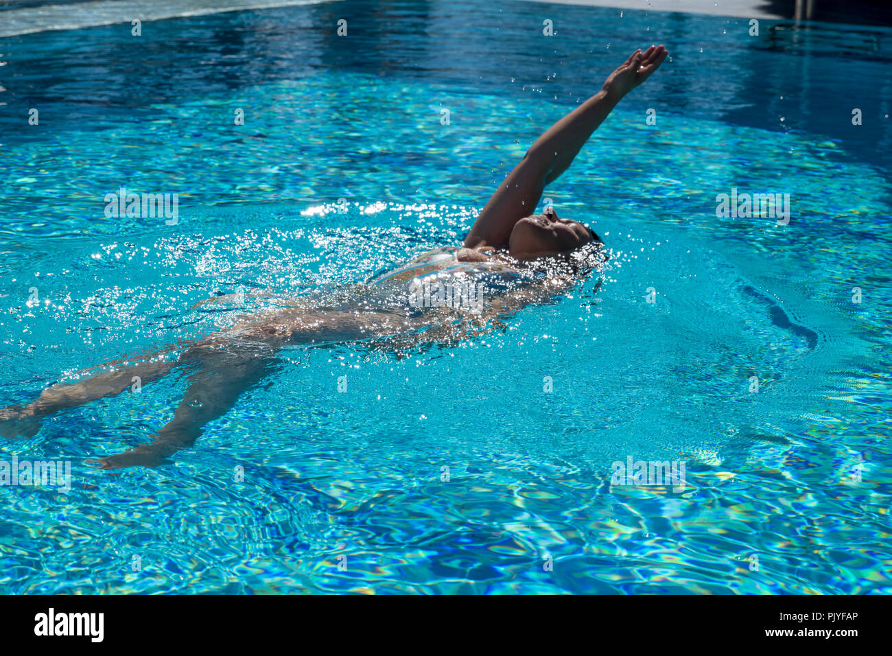 Woman Backstroke Swimming High Resolution Stock Photography and Images ...