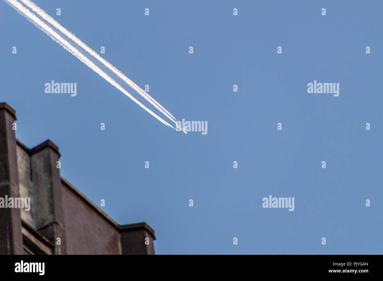 Aircraft on blue sky background Stock Photo - Alamy