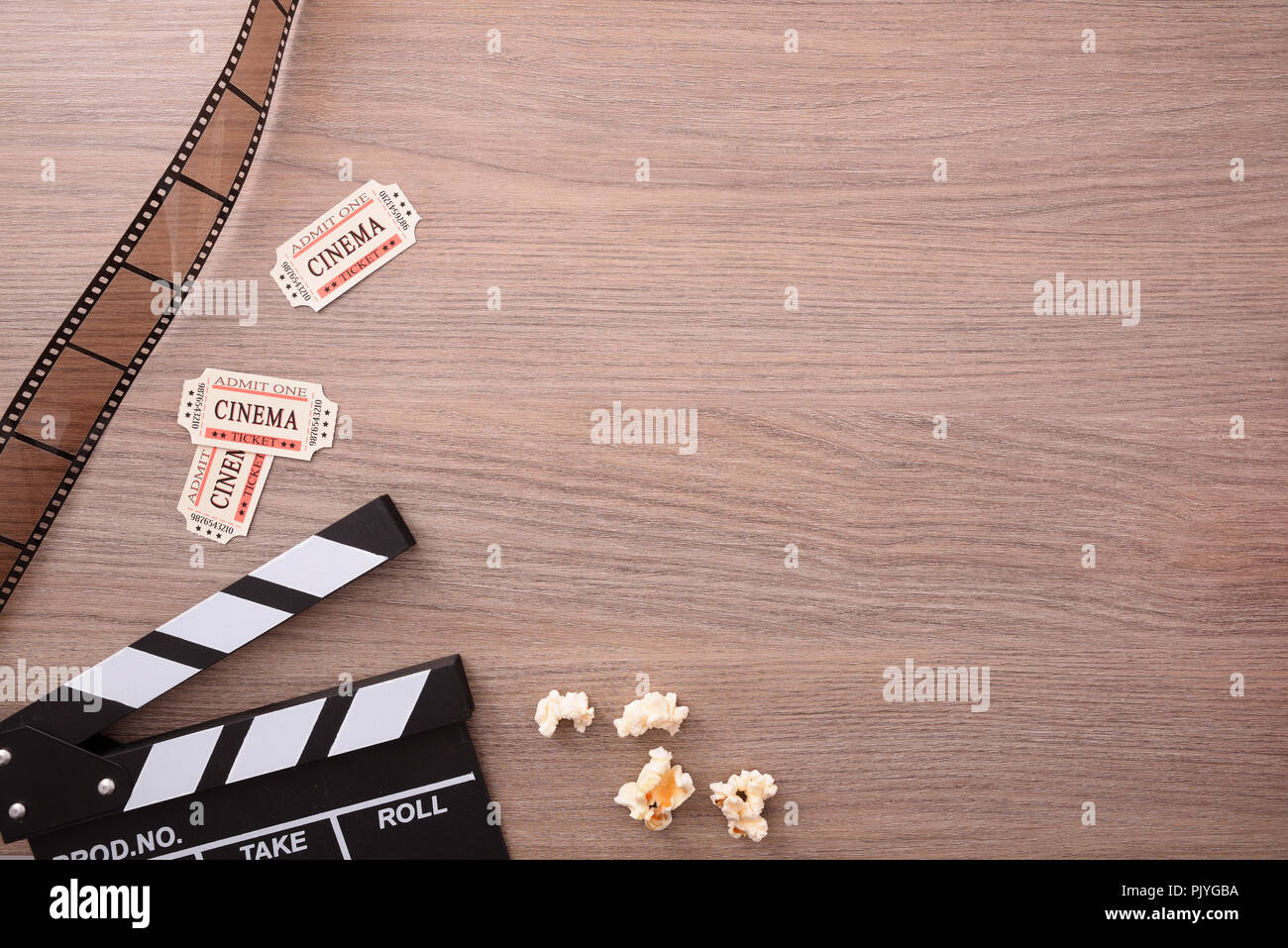 Equipment and elements of cinema on wooden table. Concept of watching ...