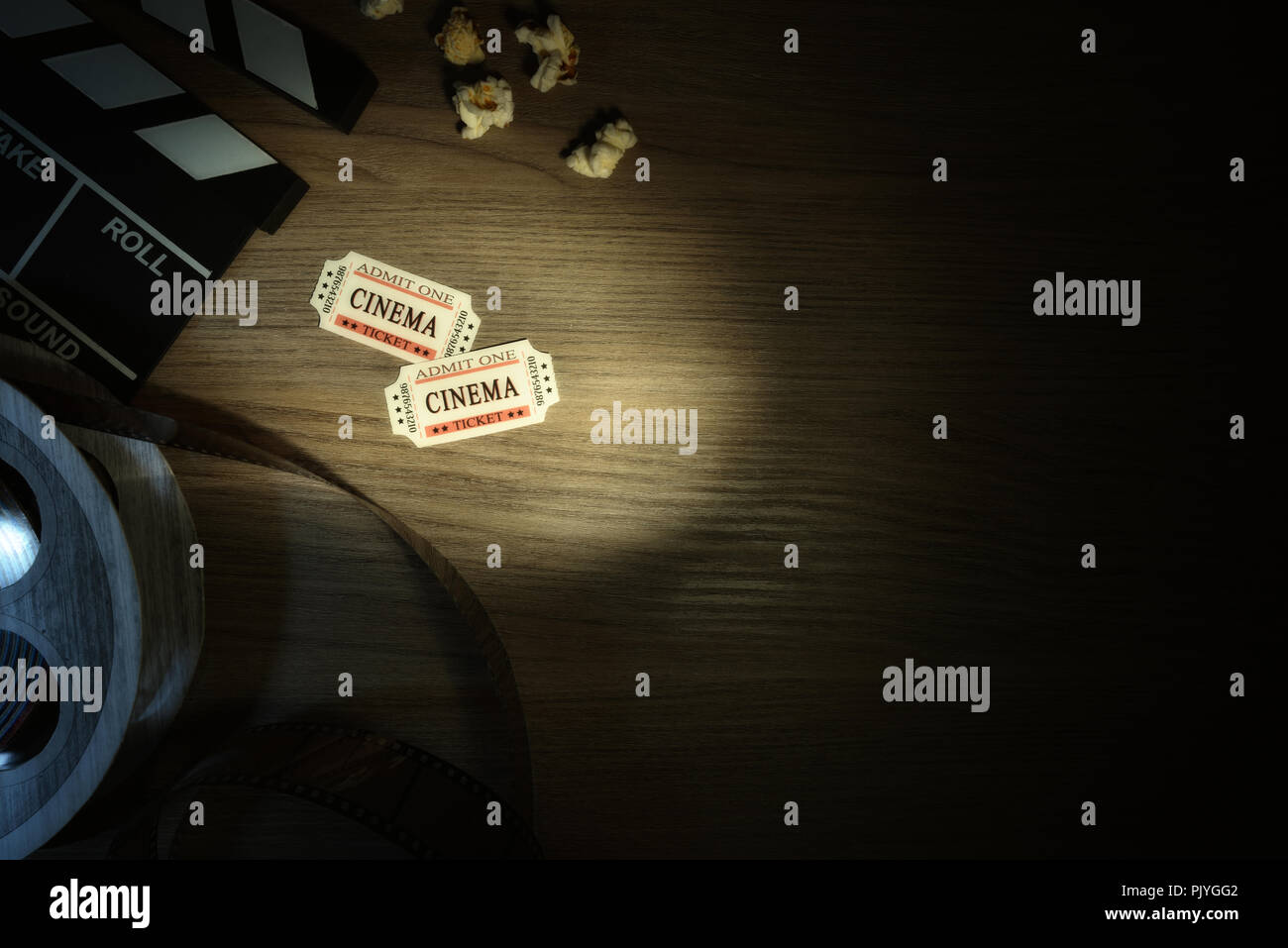 Vintage equipment and elements of cinema on wooden table. Concept of ...