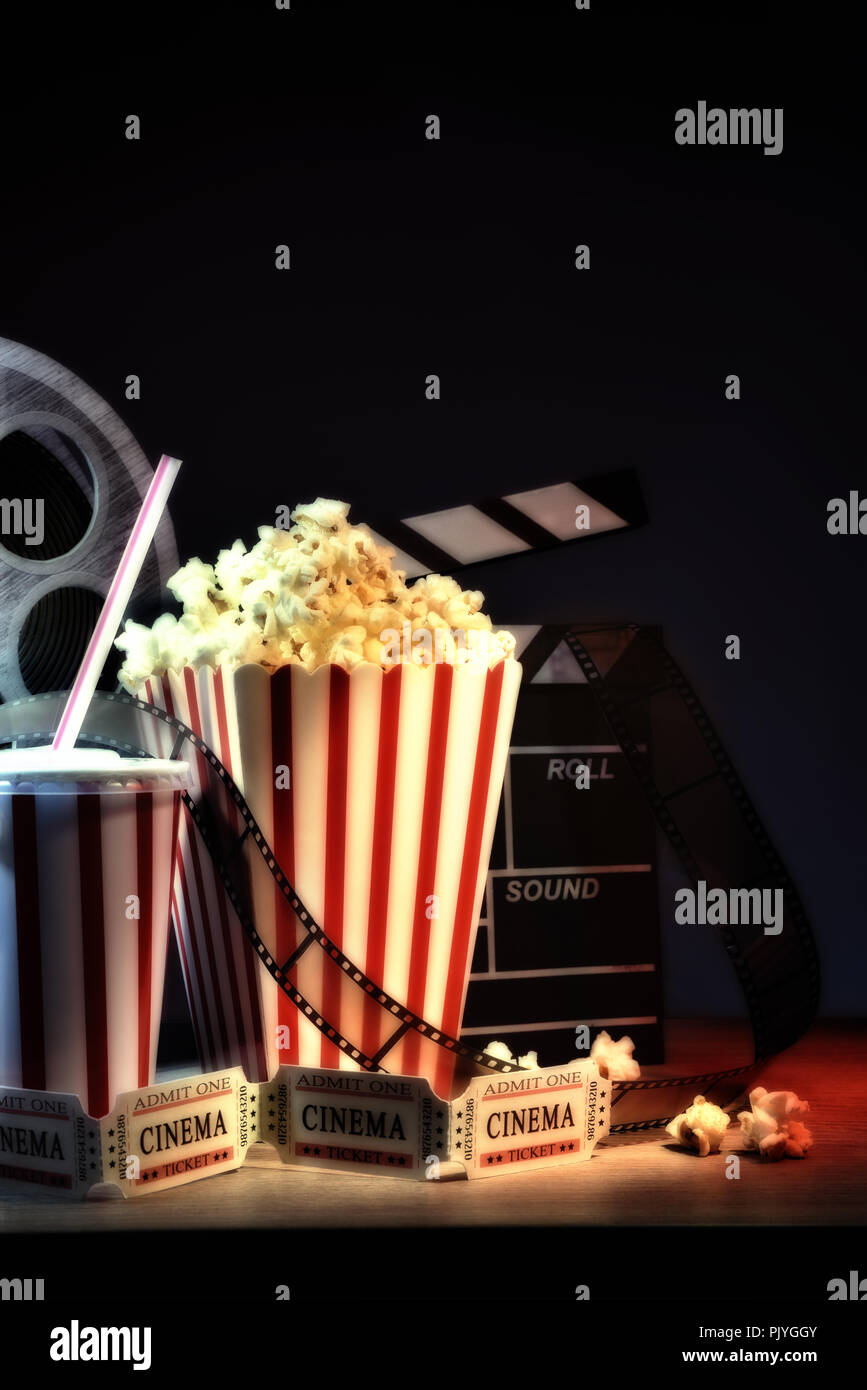 Vintage quipment and film elements on wooden table and dark background ...