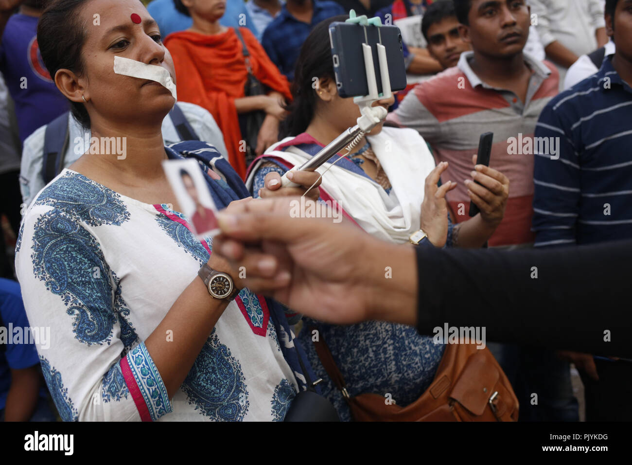Dhaka, Bangladesh. 9th Sep, 2018. An activist mouth filled with tape as ...