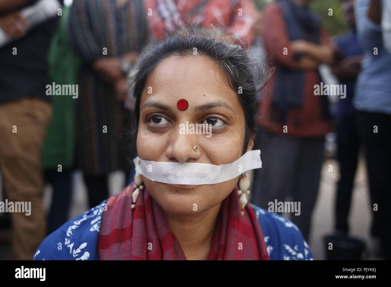 Dhaka, Bangladesh. 9th Sep, 2018. An activist mouth filled with tape as ...
