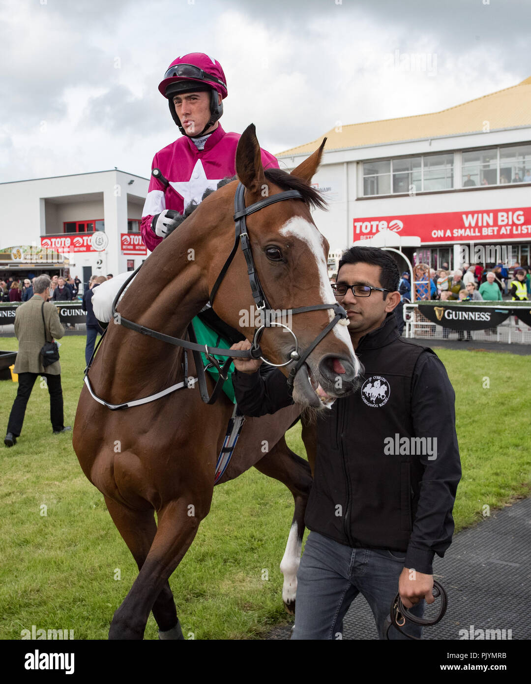 Listowel, Ireland, 9th September 2018. Race horses and jockeys in the ...