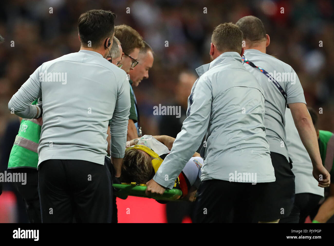Stretcher on football pitch hi-res stock photography and images - Alamy