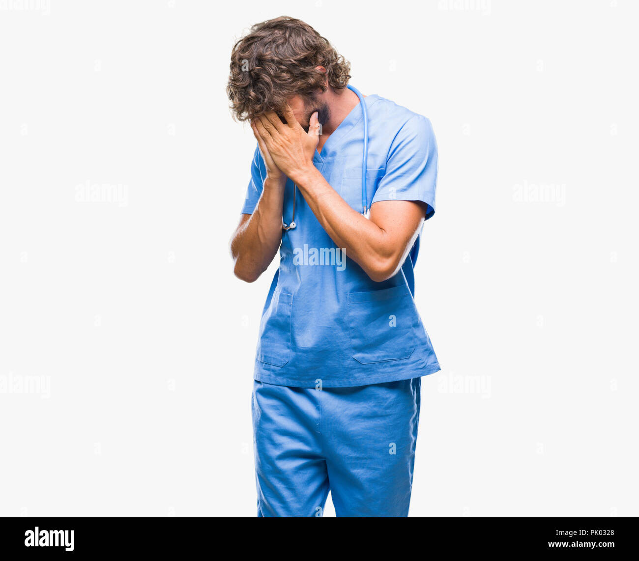 Handsome hispanic surgeon doctor man over isolated background with sad ...