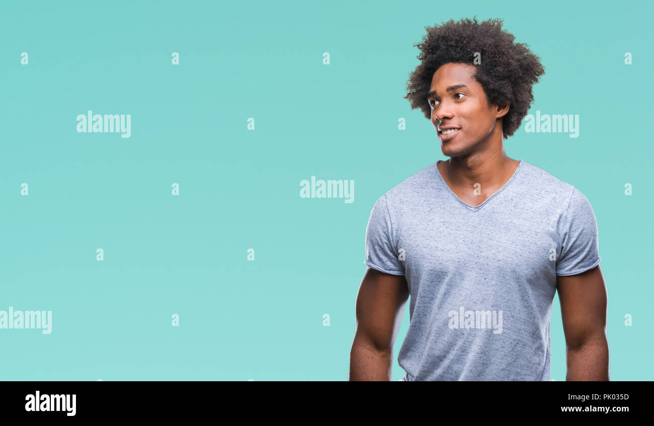 Afro american man over isolated background looking away to side with ...