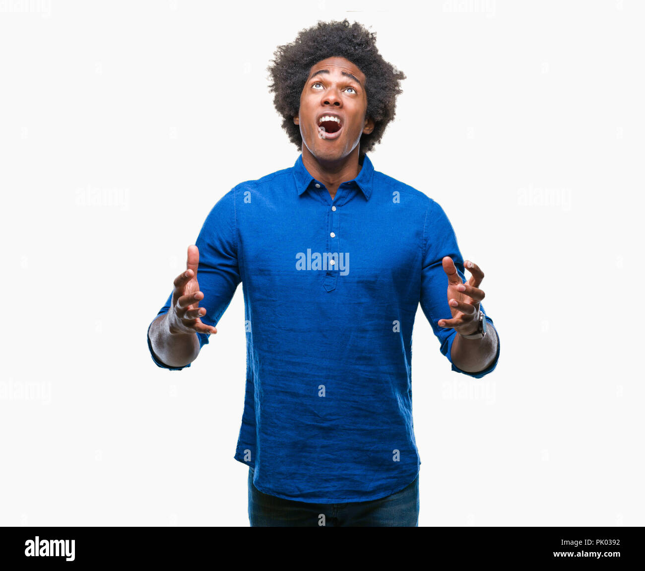 Afro american man over isolated background crazy and mad shouting and ...