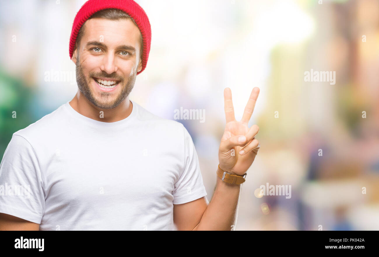 Young handsome man over isolated background smiling with happy face ...