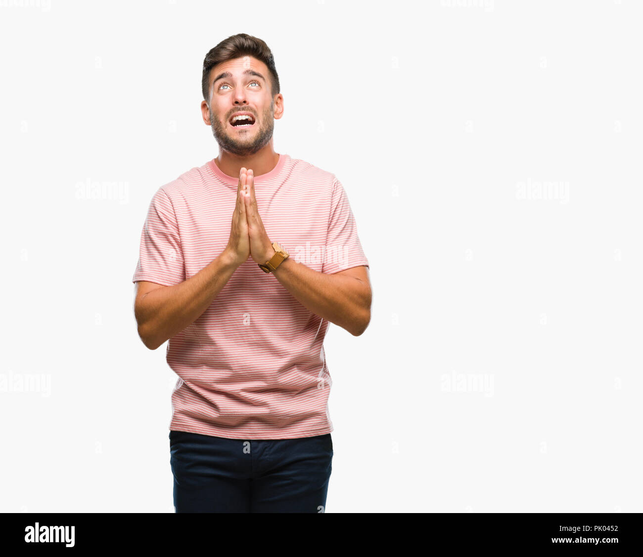 Young handsome man over isolated background begging and praying with ...