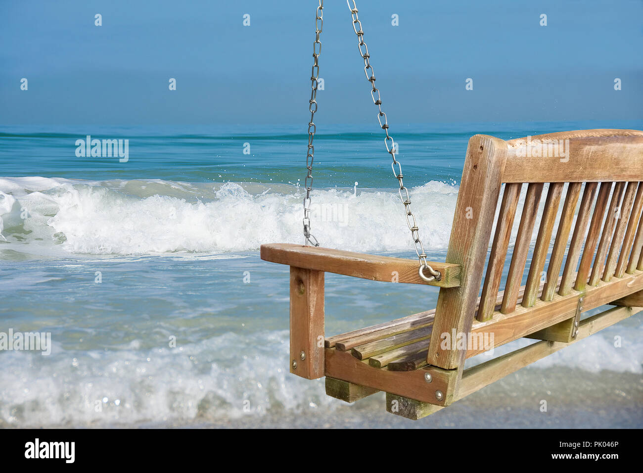 rustic wooden beach swing with turquoise ocean surf view Stock Photo ...