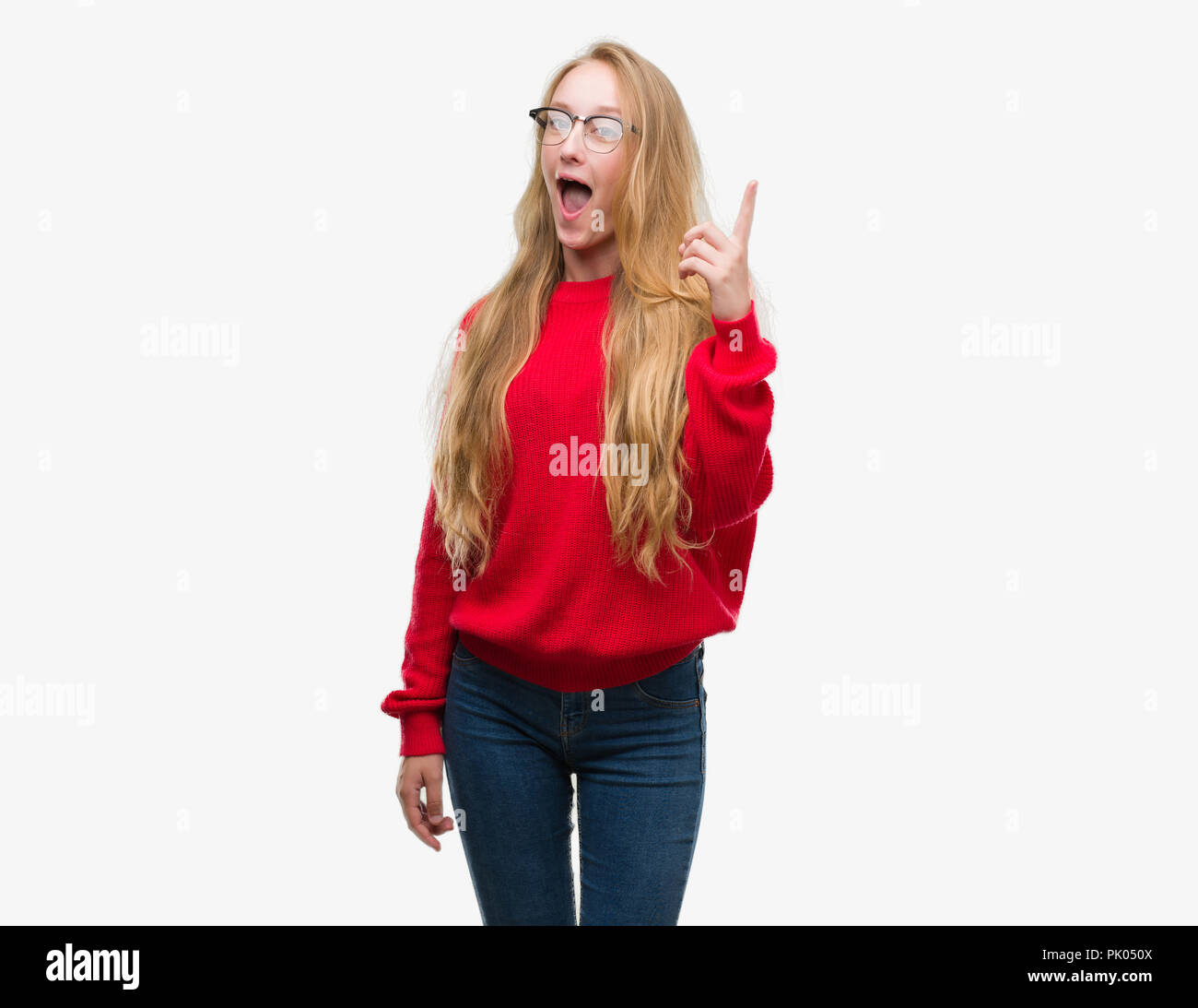 Blonde Teenager Woman Wearing Red Sweater Pointing Finger Up With Successful Idea Exited And