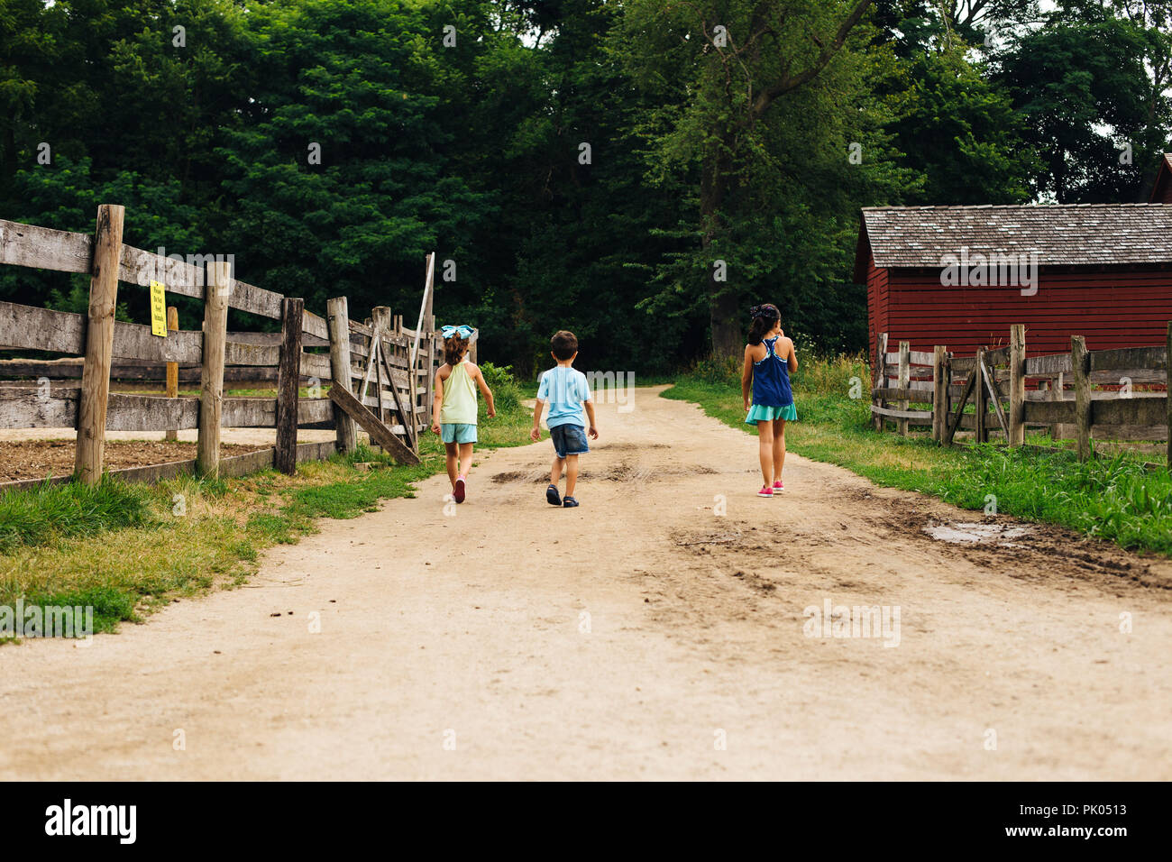Kids walking on farm Stock Photo - Alamy
