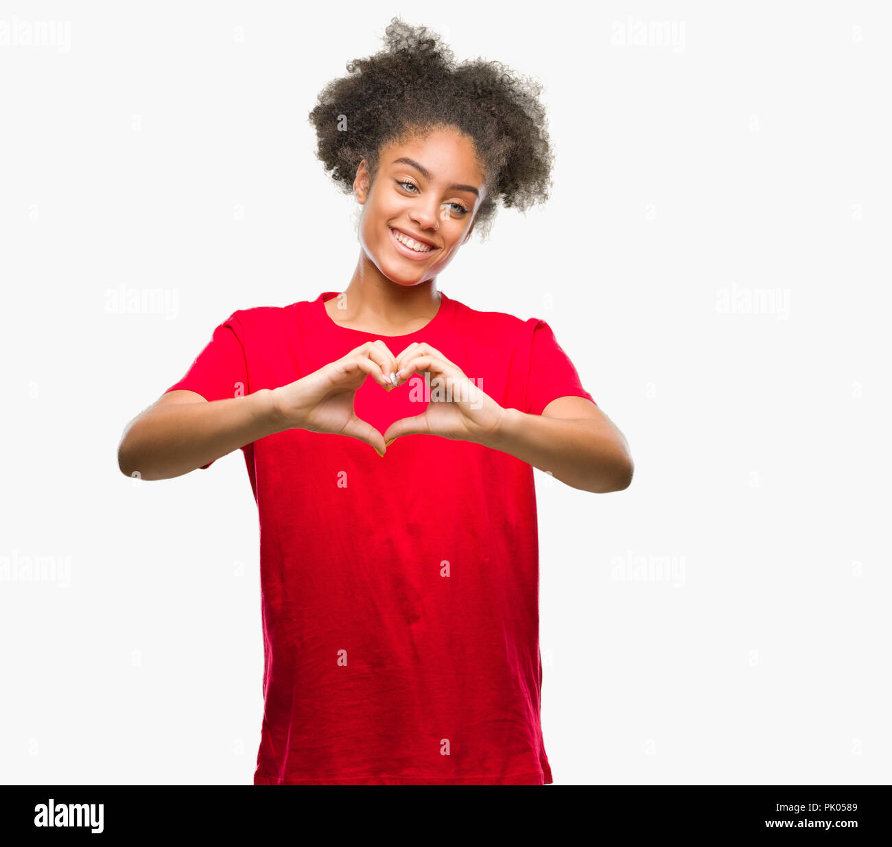Young afro american woman over isolated background smiling in love ...