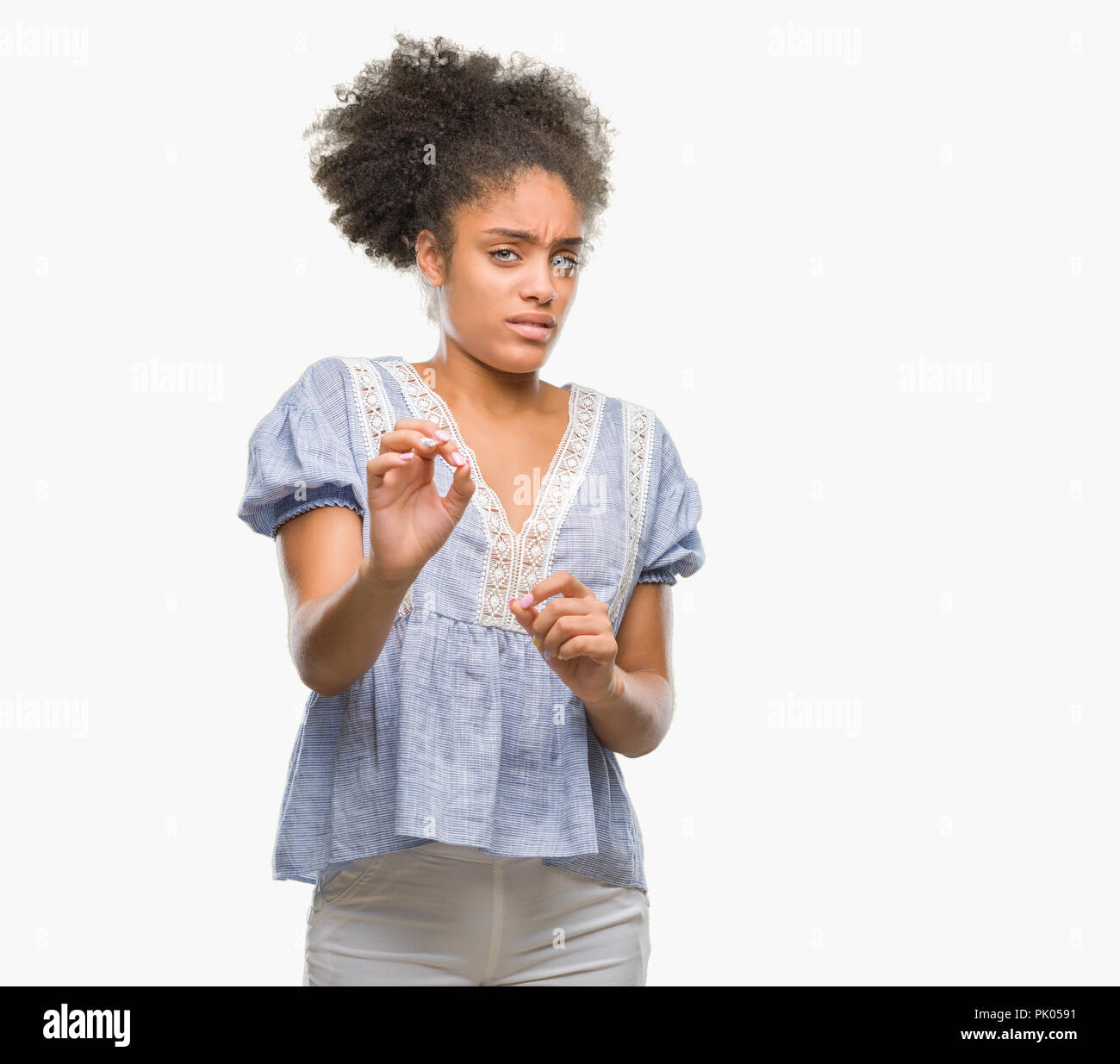 Young afro american woman over isolated background disgusted expression ...