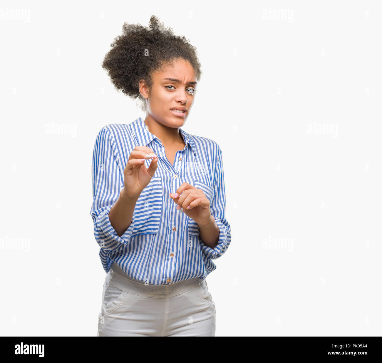 Young afro american woman over isolated background disgusted expression ...