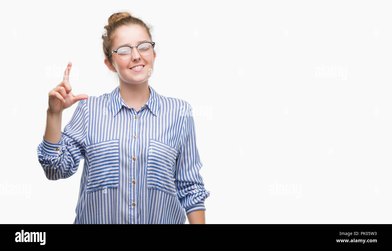 Young blonde business woman smiling and confident gesturing with hand ...