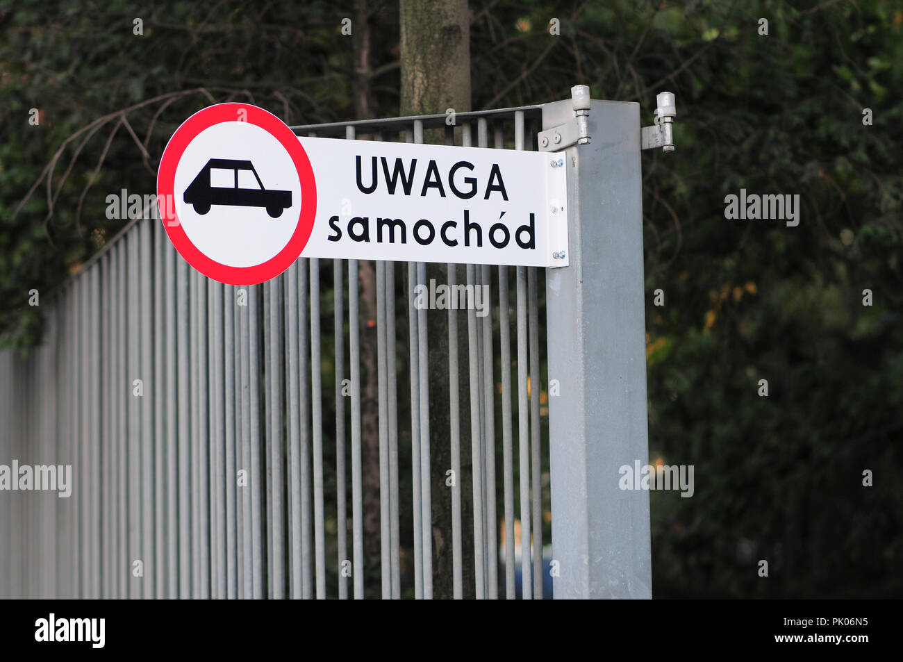 Sign warning pedestrians that vehicles may be emerging from an entrance ...