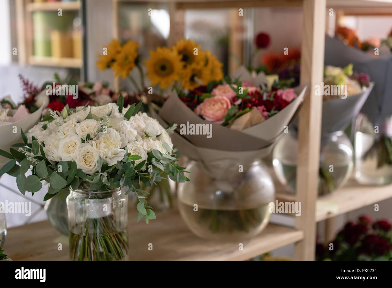 Flower shop concept. Different varieties fresh spring flowers in ...