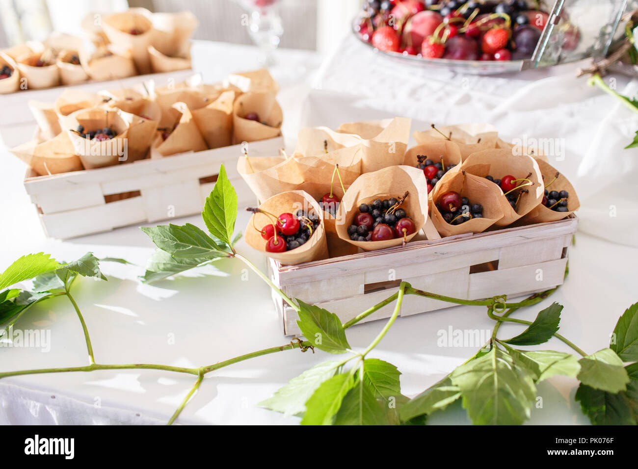 candy bar. Fresh Fruit in envelope on banquet table at business or ...
