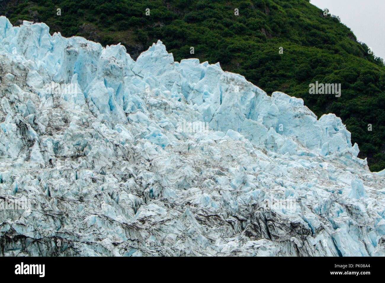 Blue ice pinnacle details on Harriman Glacier, Alaska, USA. Closeup of ...