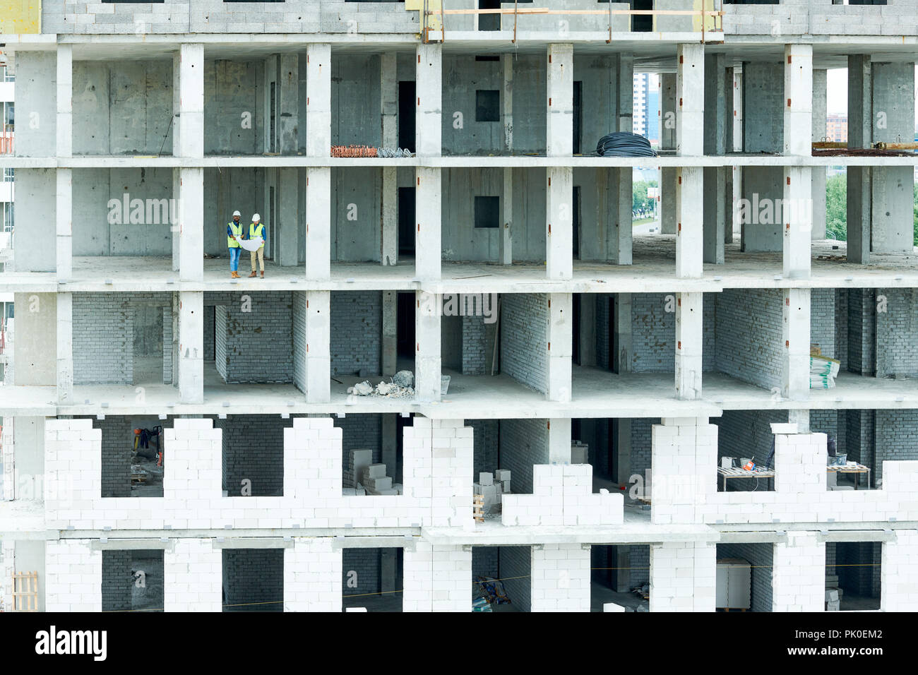 Construction workers on building site of apartment house Stock Photo ...