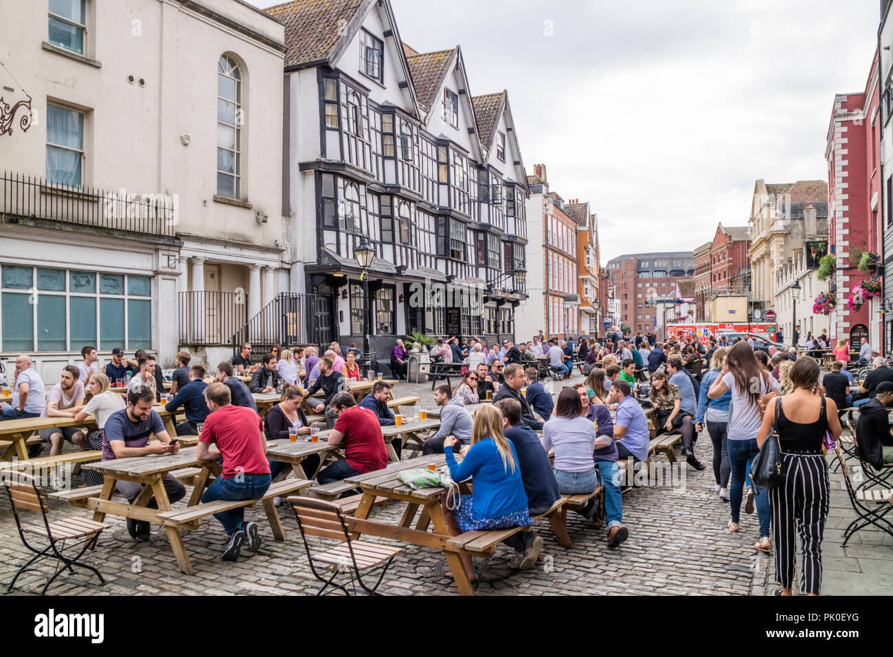 People relaxing at a pub in King Street in the city of Bristol, England ...