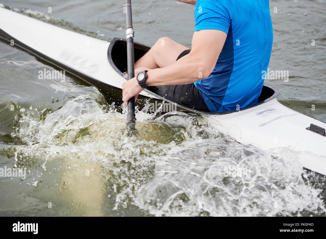 Man floating in canoe Stock Photo - Alamy
