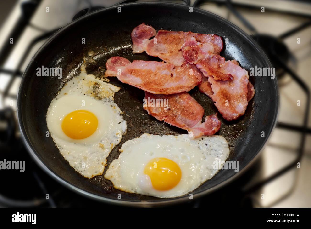 Fried egg bacon breakfast unhealthy food leading to obesity and fat ...