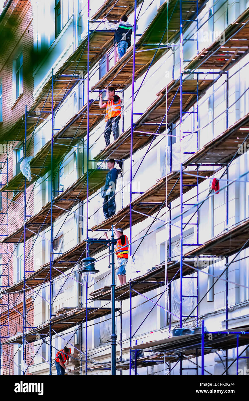 Construction of a new high-rise urban residential building, workers on ...