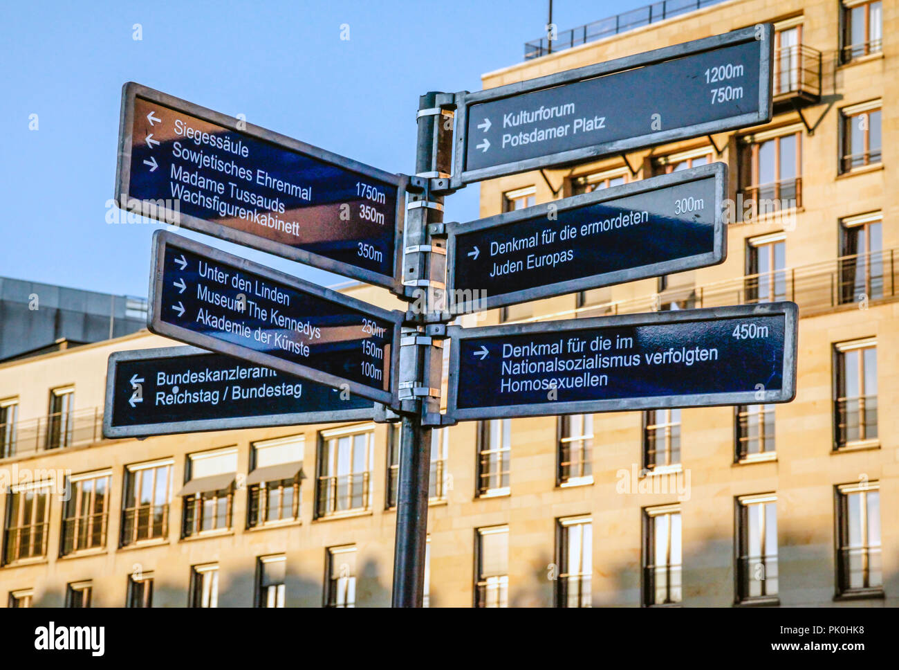 Multiple destination signposts made of metal in Pariser Platz near the ...