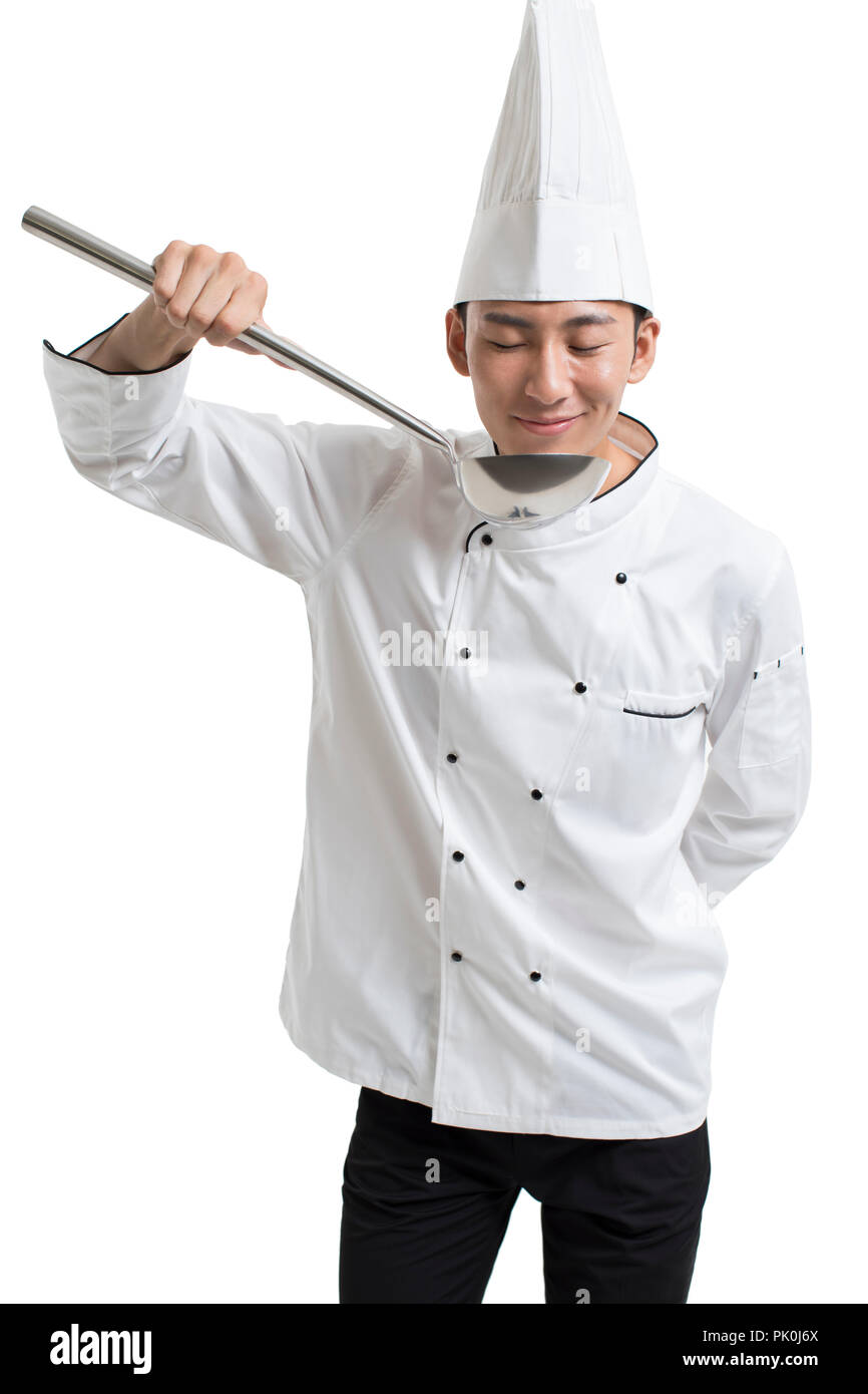 Cheerful chef holding a ladle Stock Photo - Alamy