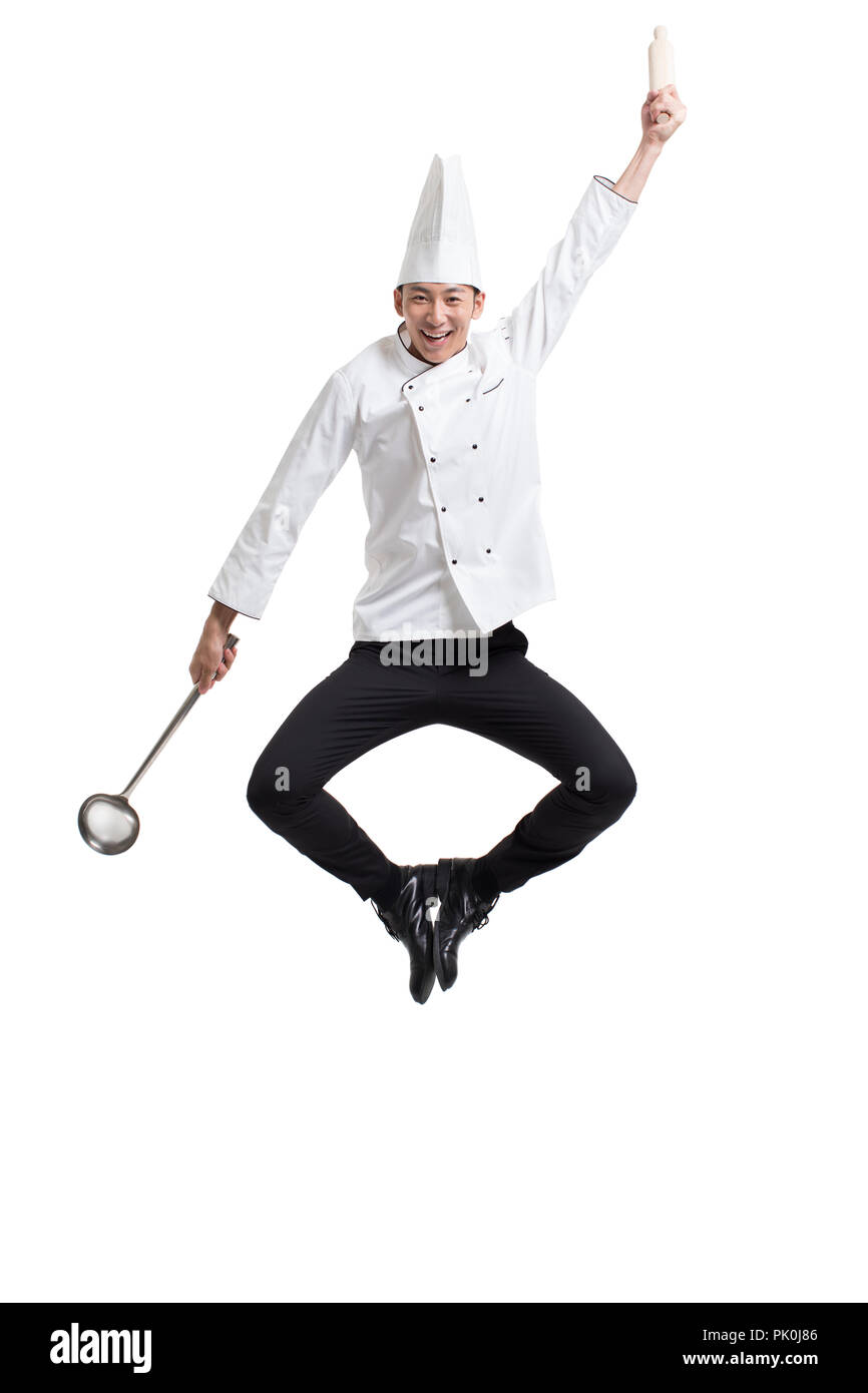 Young man cooking Cut Out Stock Images & Pictures - Alamy