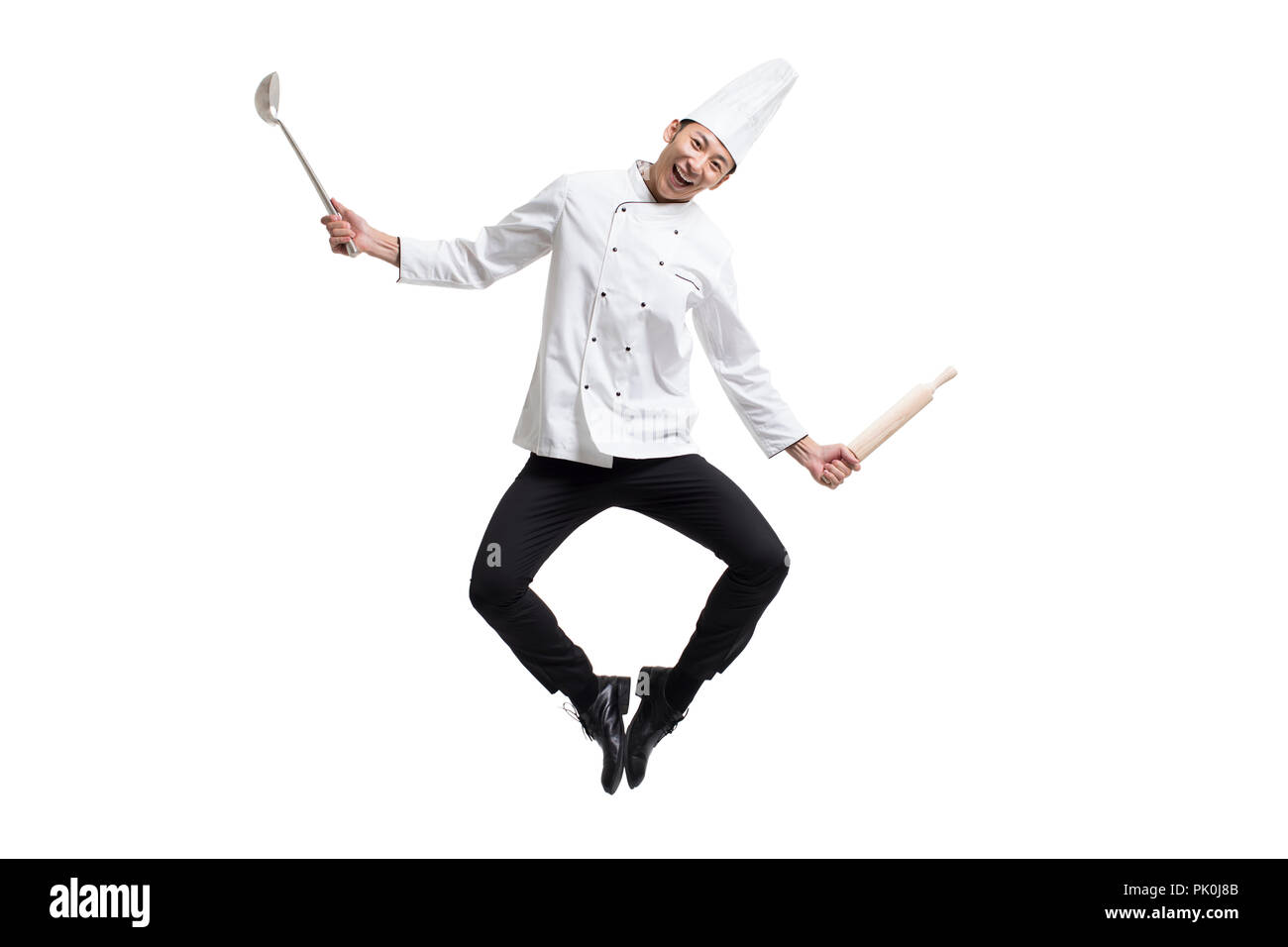 Young man cooking Cut Out Stock Images & Pictures - Alamy