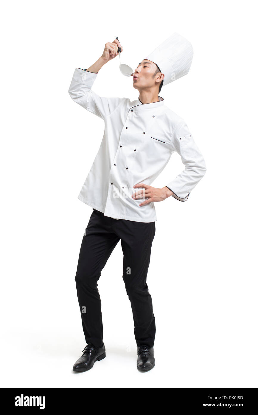 Cheerful chef holding a ladle Stock Photo - Alamy