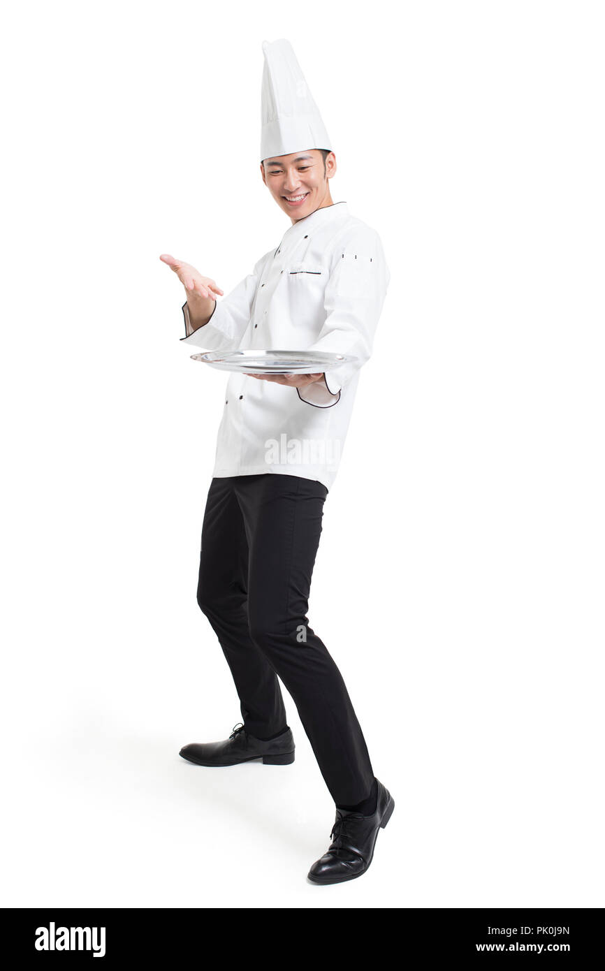 Cheerful chef serving food Stock Photo - Alamy