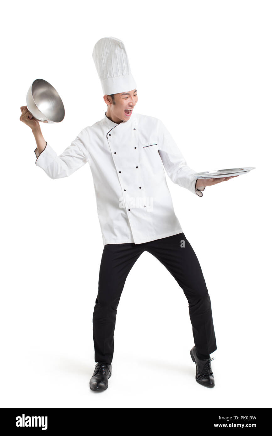 Cheerful chef serving food Stock Photo - Alamy