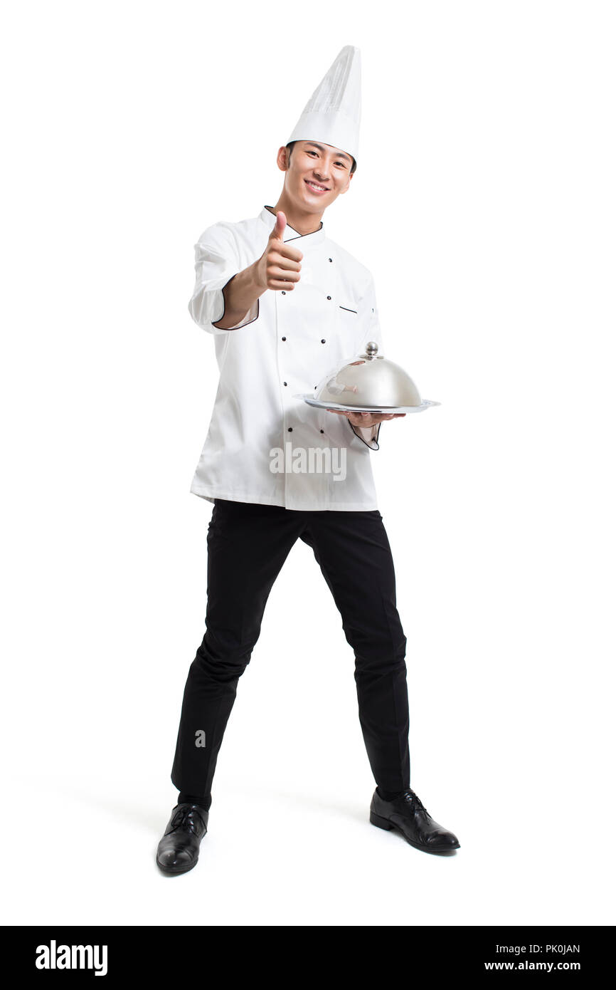 Cheerful chef serving food Stock Photo - Alamy