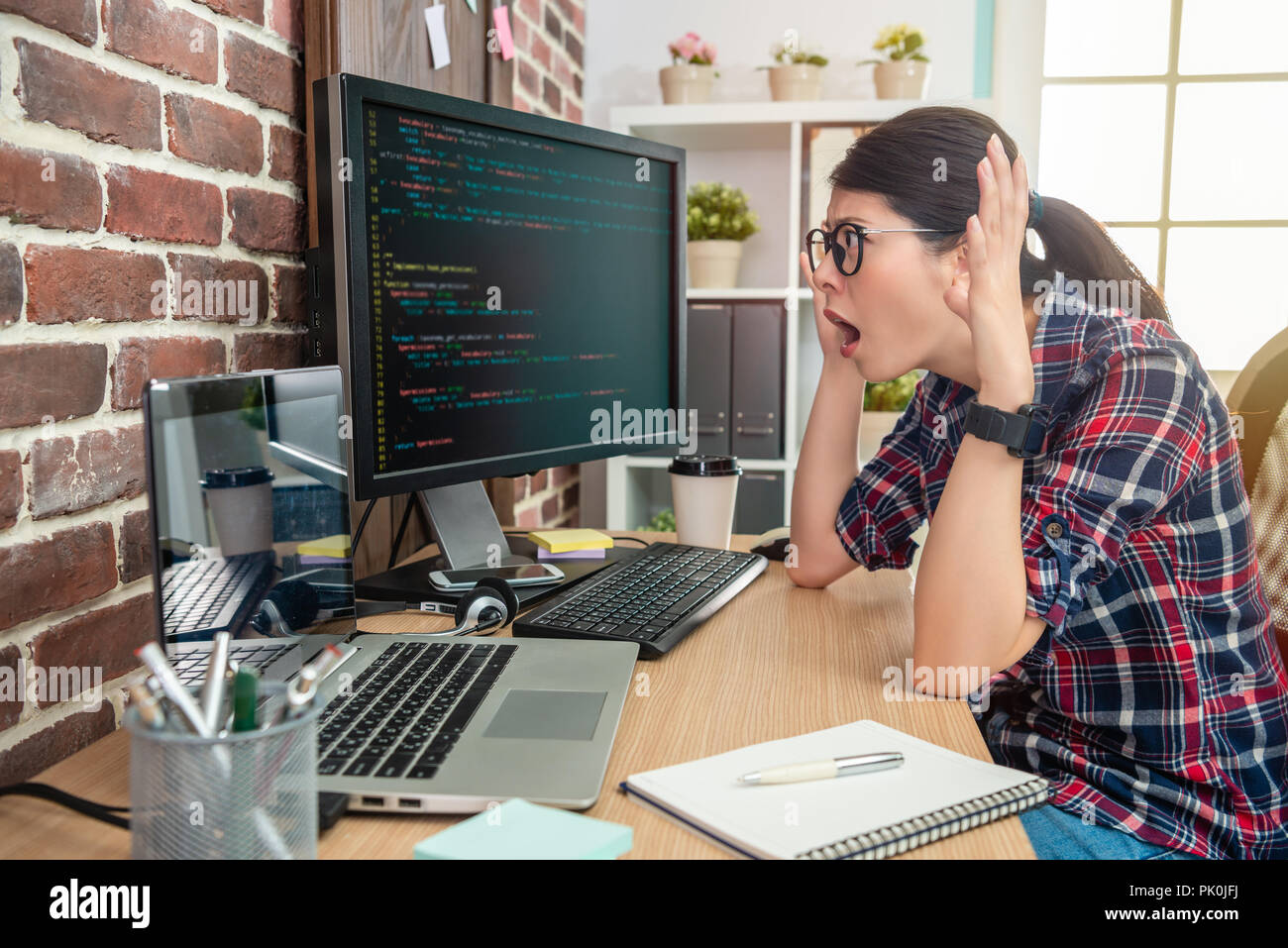 asian female programmer feeling crazy and overwhelmed about working in ...