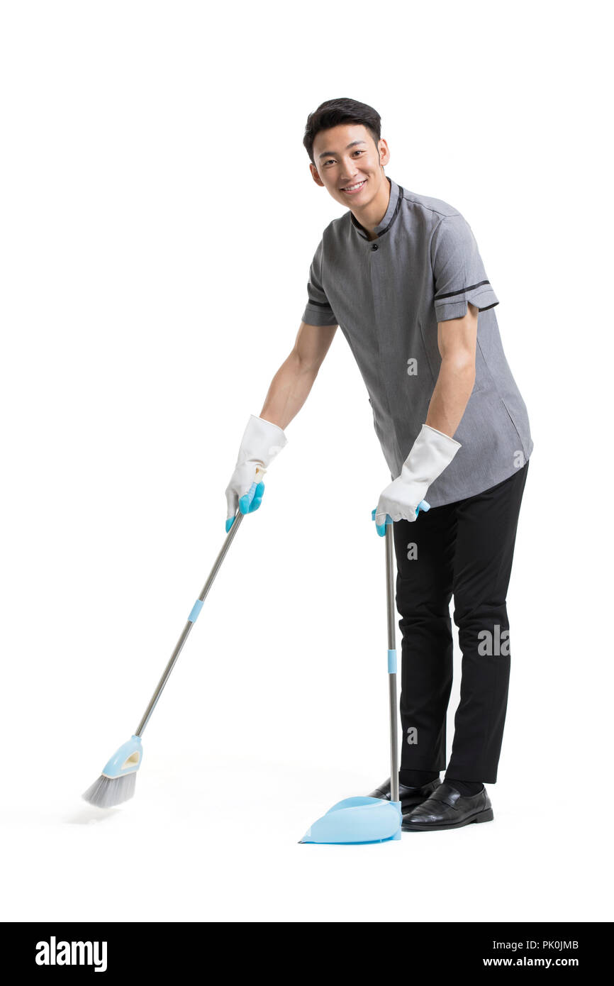 Man sweeping floor dustpan broom hi-res stock photography and images ...