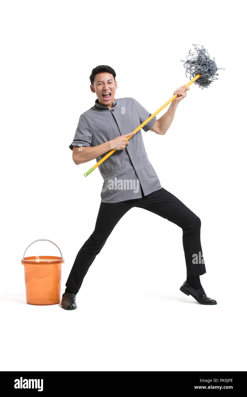 Cheerful cleaner singing Stock Photo - Alamy