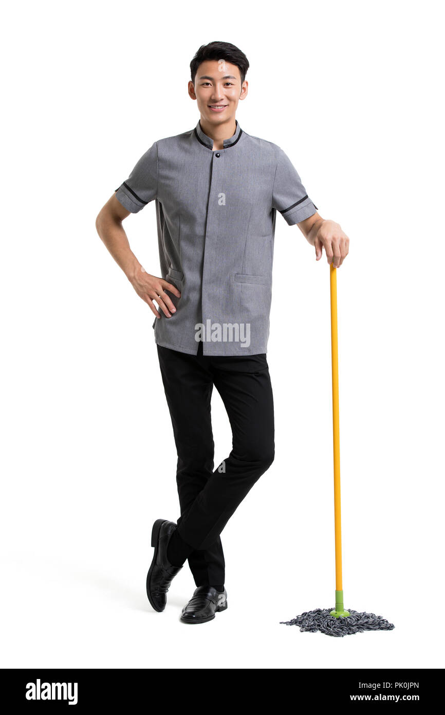 Cheerful cleaner holding a mop Stock Photo - Alamy